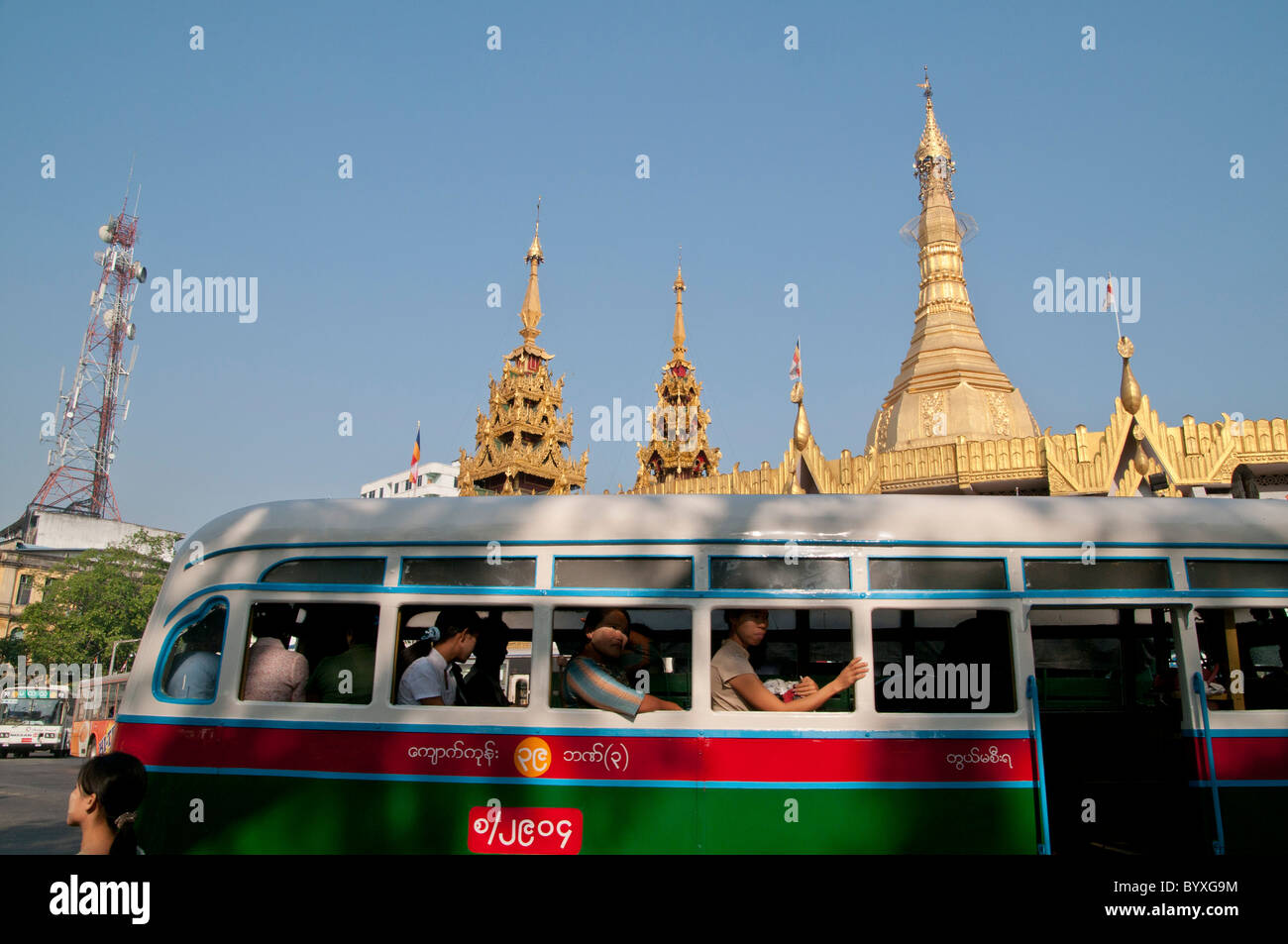 MYANMAR (BURMA) BUS GOES PAST THE SULE PAGODA IN DOWNTOWN YANGON Stock ...