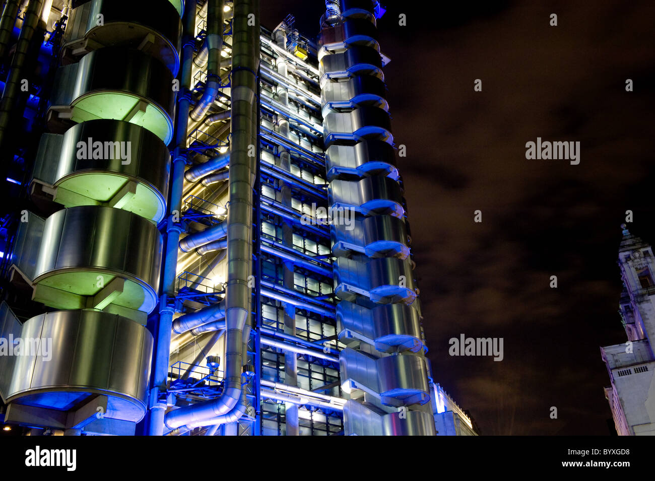 A section of the Lloyds building in the City of London, lit up at night ...