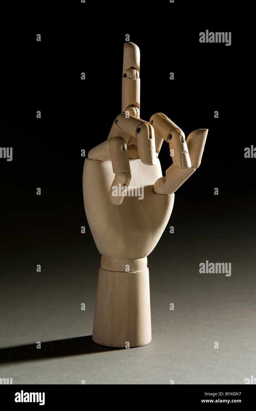 wooden hand pointing upwards on dark background Stock Photo - Alamy