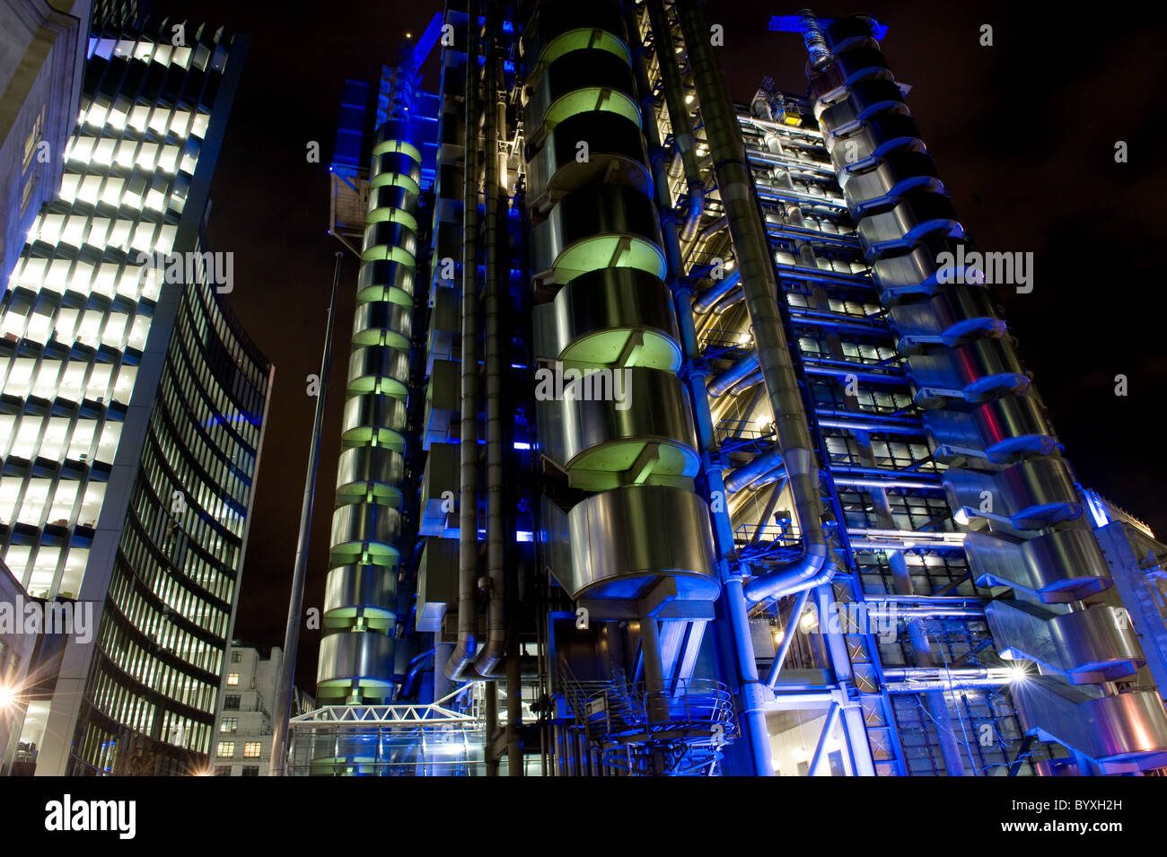 A section of the Lloyds building in the City of London, lit up at night ...