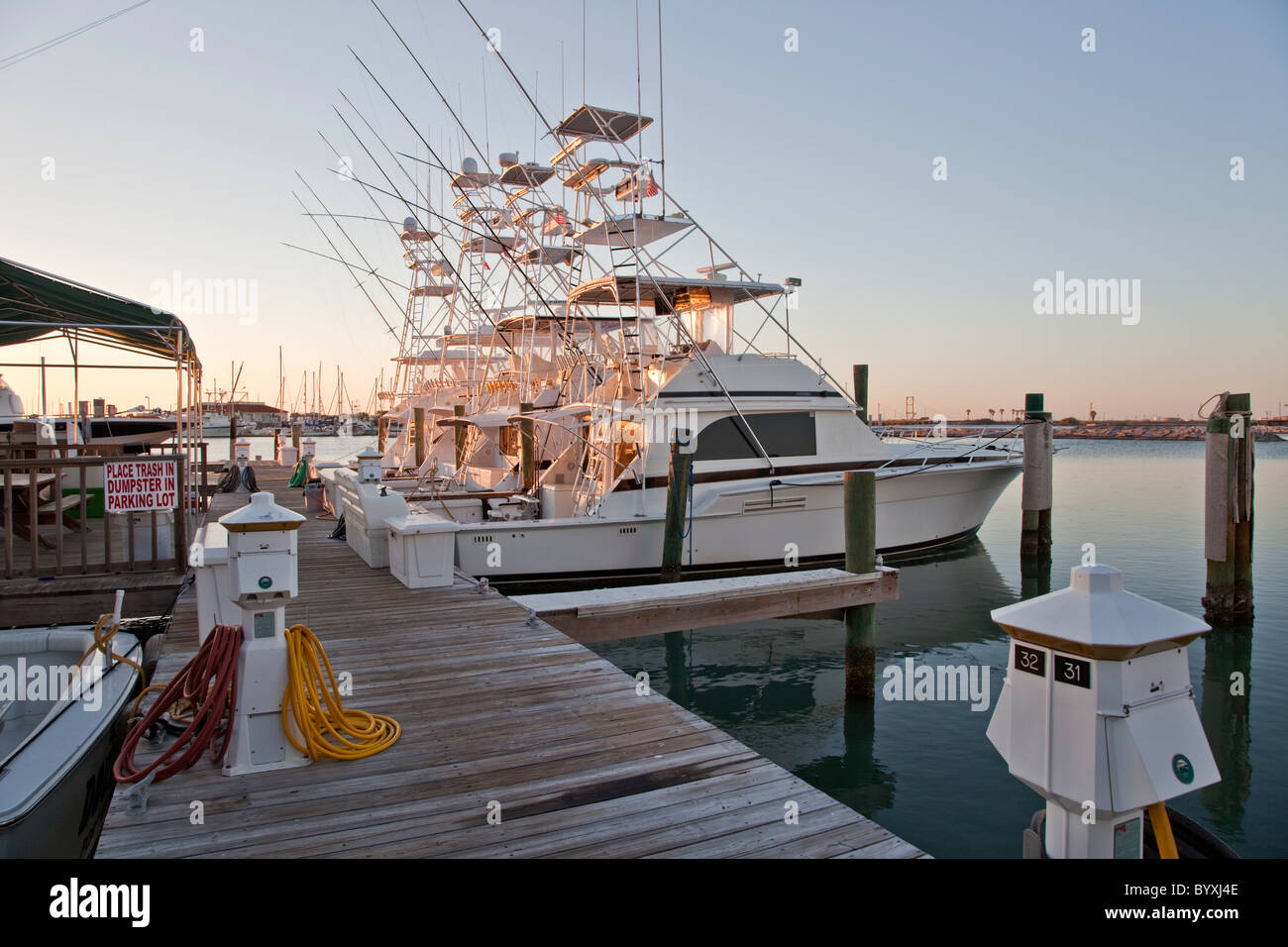 Pier with fishing boats hi-res stock photography and images - Alamy