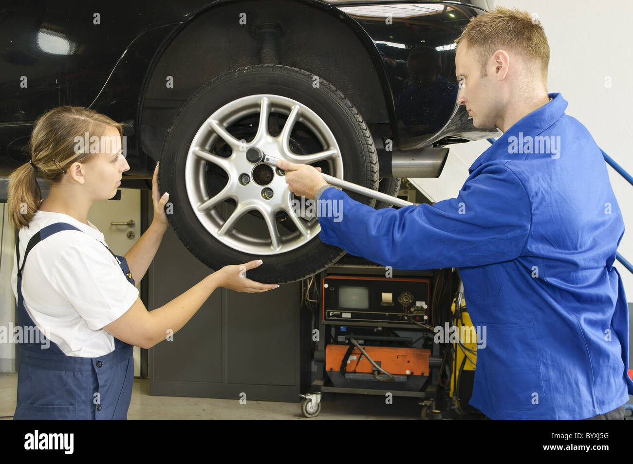 Changing tires in the garage Stock Photo - Alamy