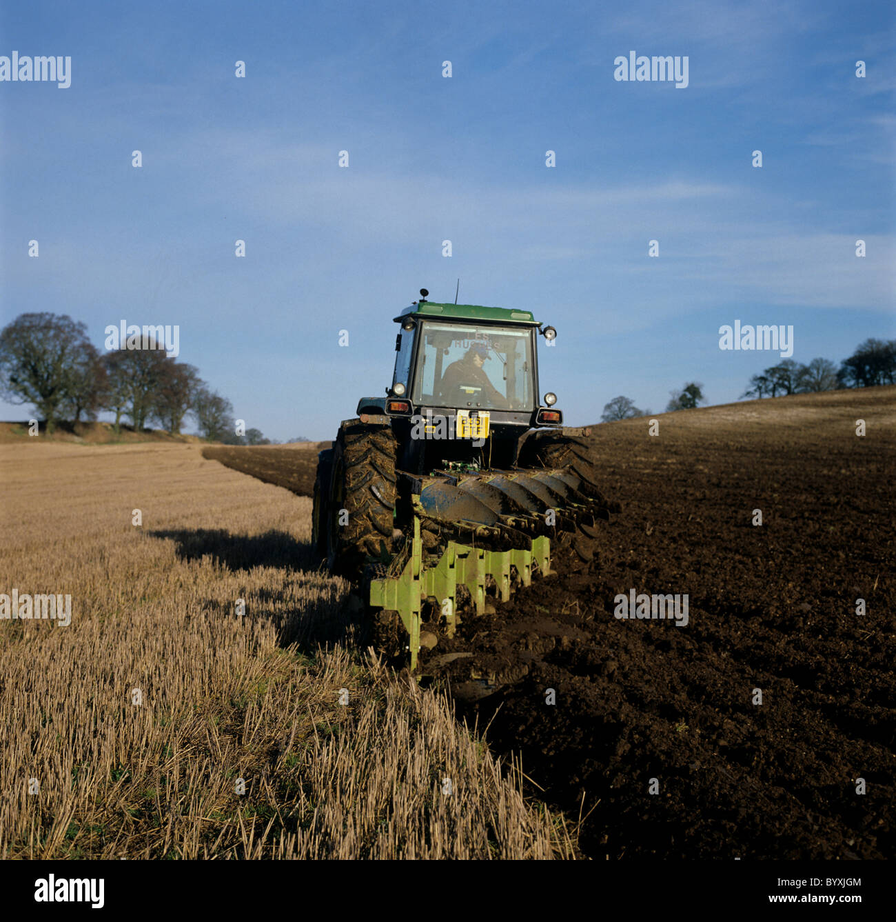 John deere tractor ploughing stubble hi-res stock photography and ...