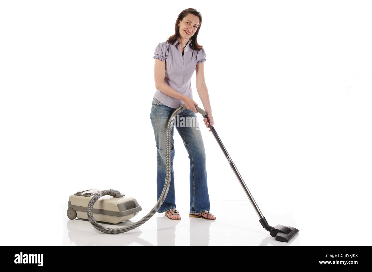 Housewife, maid with vacuum cleaner Stock Photo - Alamy