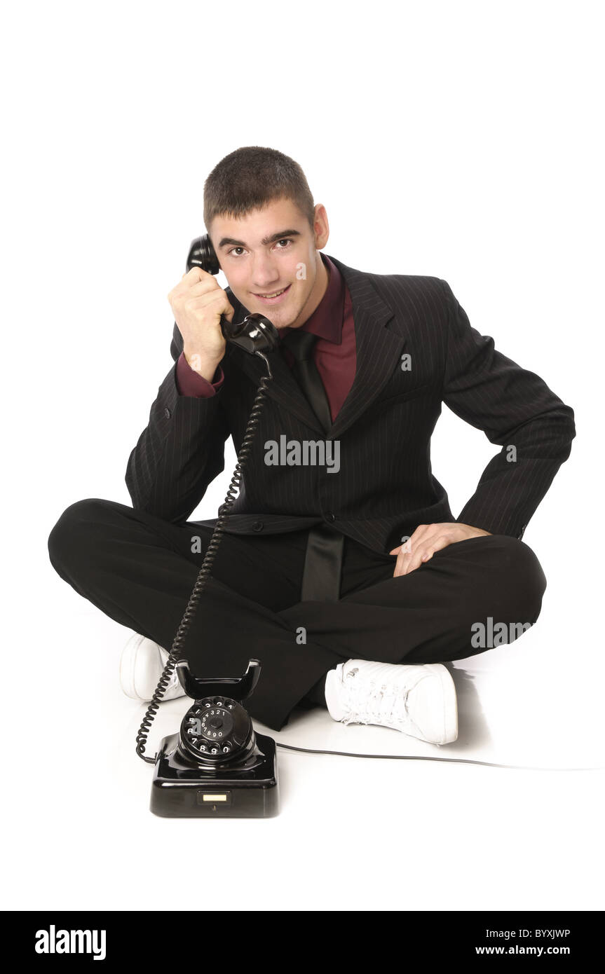 Young man in suit with antique phone calls Stock Photo - Alamy