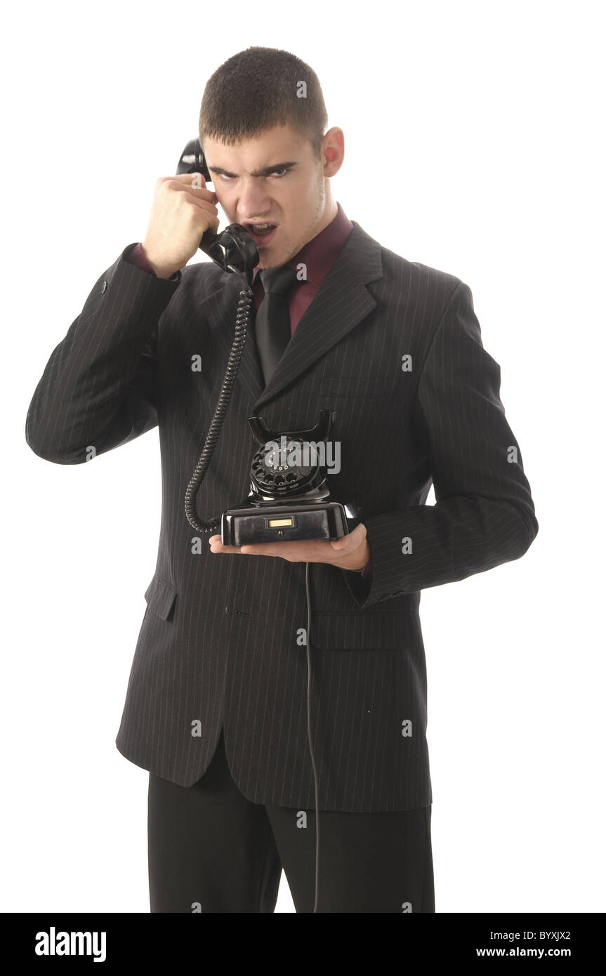 Young man in suit with antique phone calls Stock Photo - Alamy
