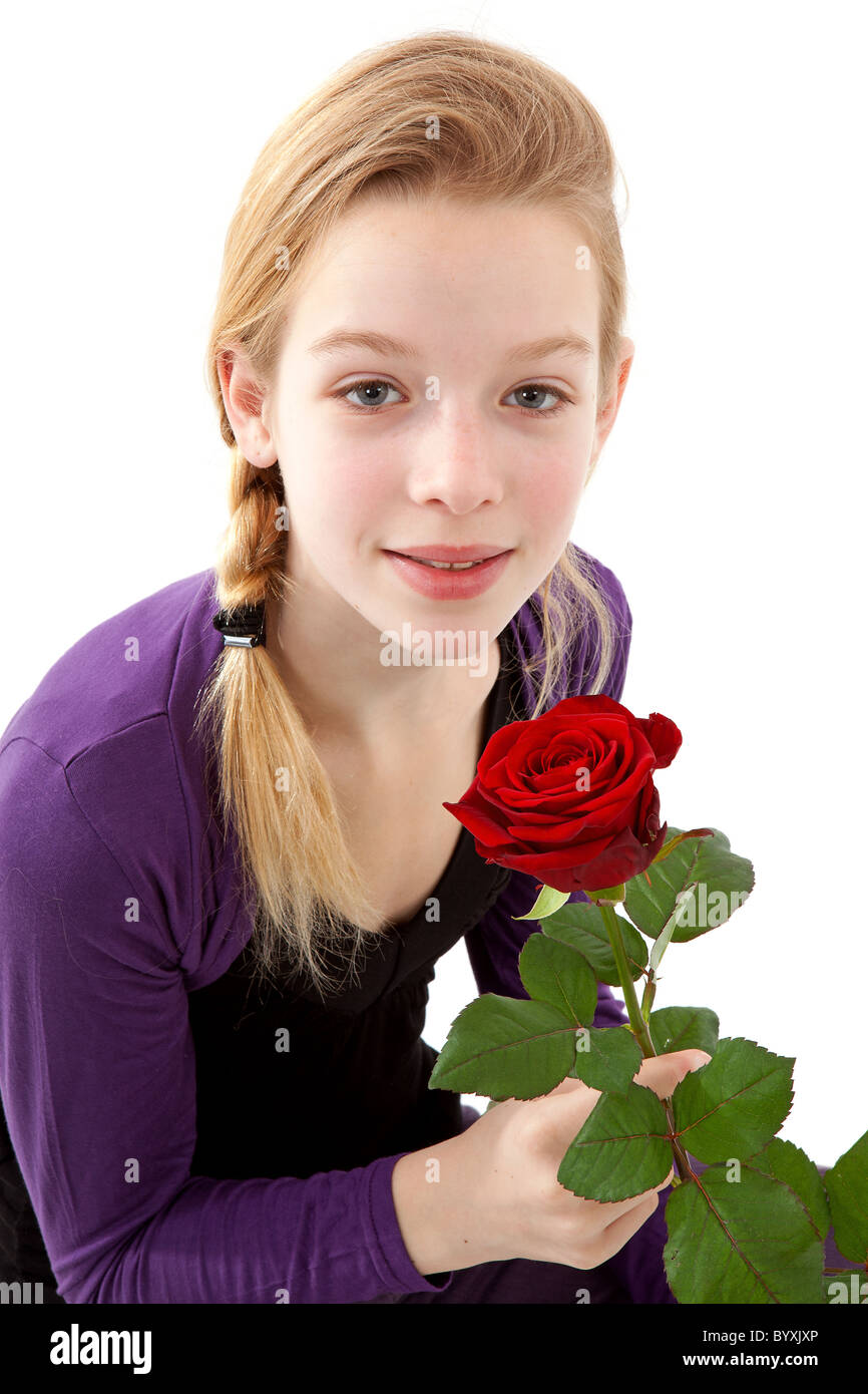 young girl posing with red rose in closeup over white background Stock ...