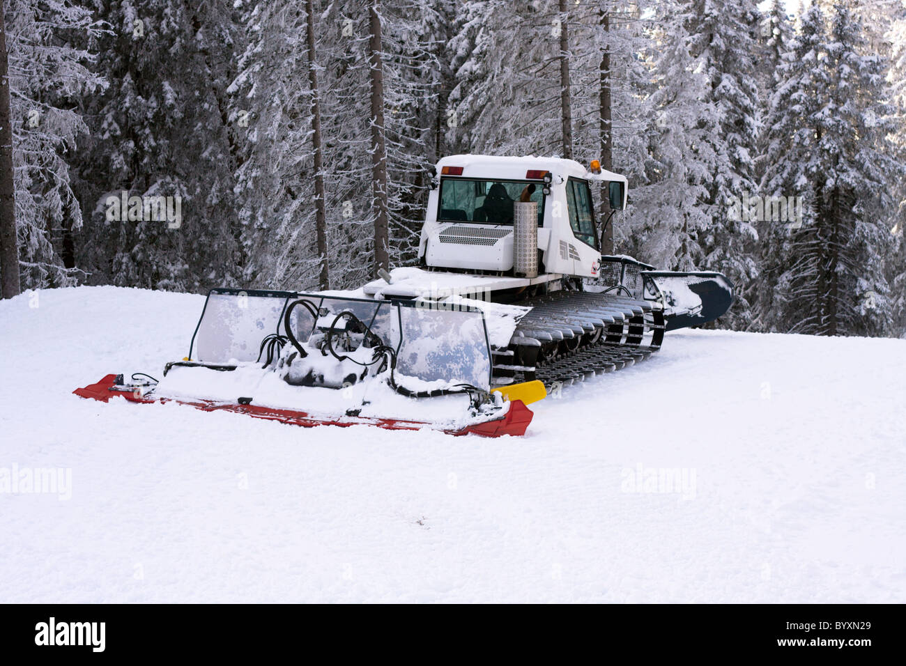 Snow preparation machine (snow cat) on the top of the hill at the ski ...