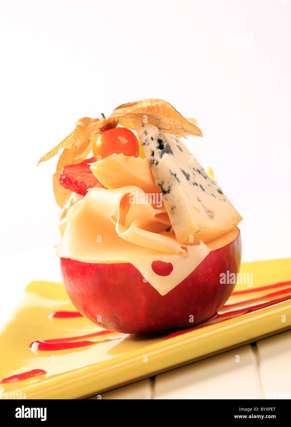 Pieces of cheese on a red apple Stock Photo - Alamy