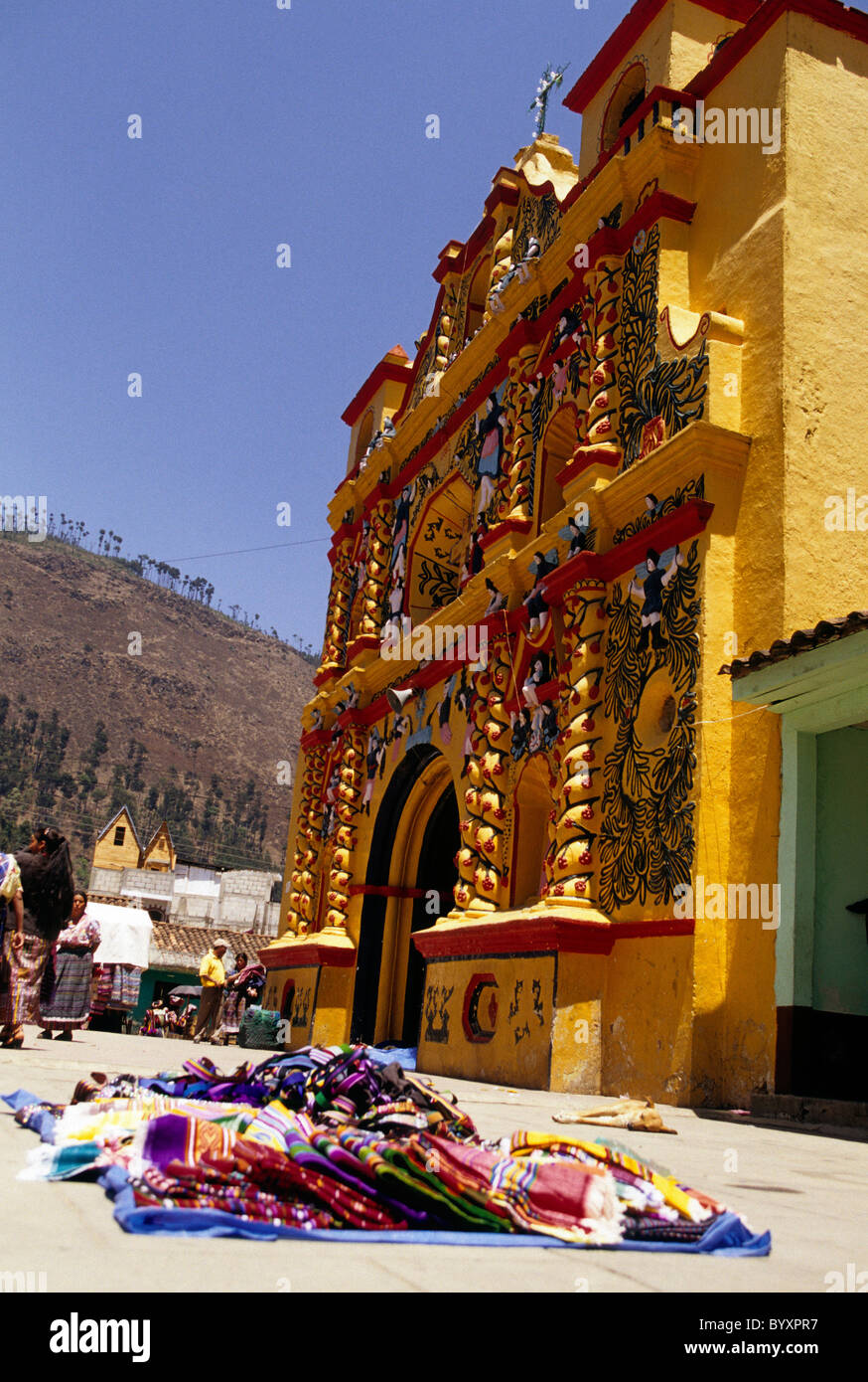 Exterior of the multi colored church in the village of San Andres Xecul ...