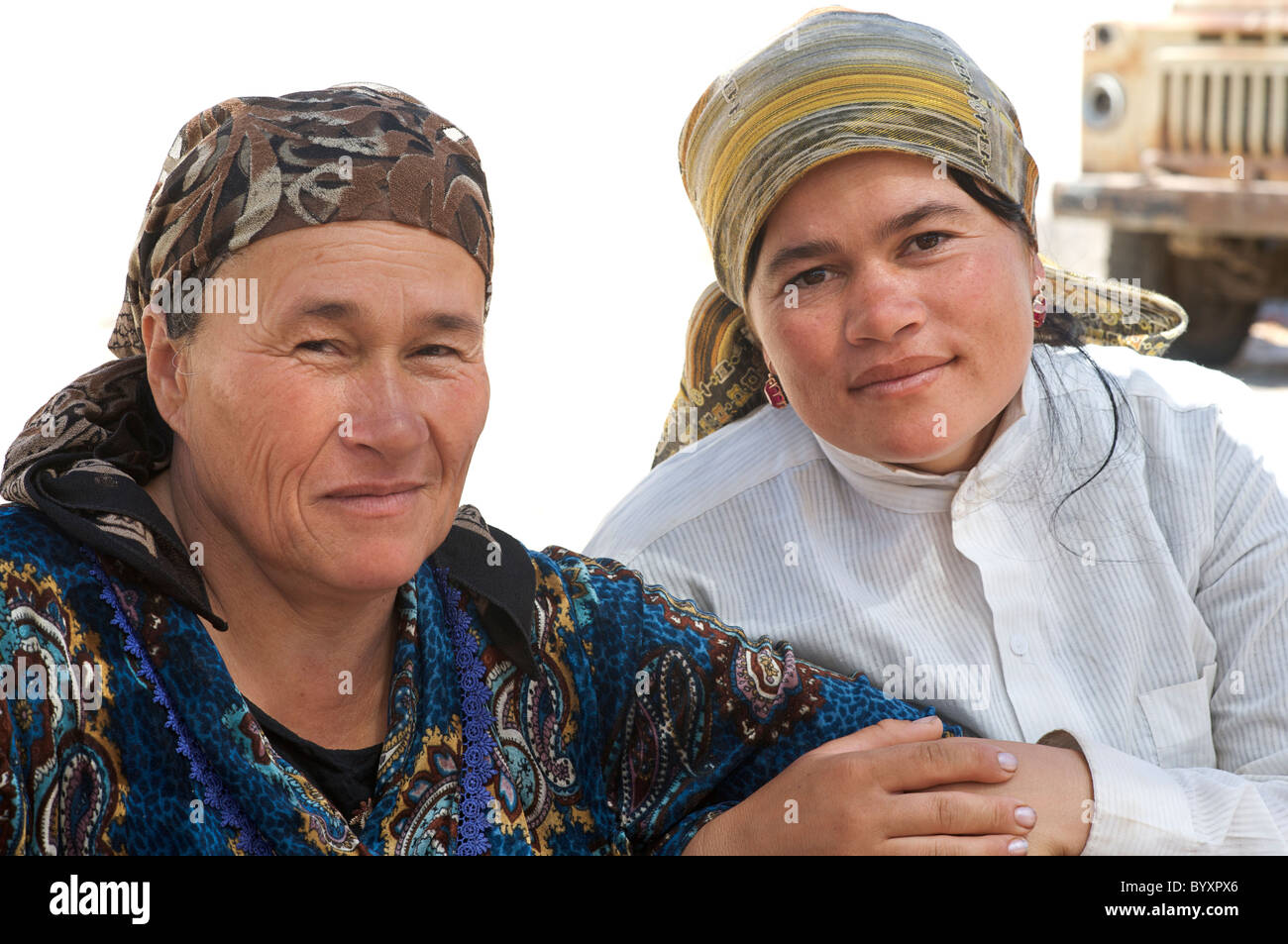 Portrait of Uzbeki mother and daughter in distinctive headscarves as ...