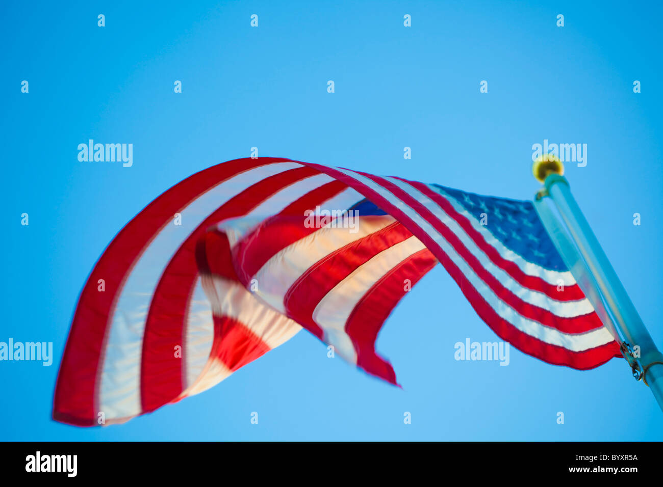 This is the US flag blowing in the wind Stock Photo - Alamy