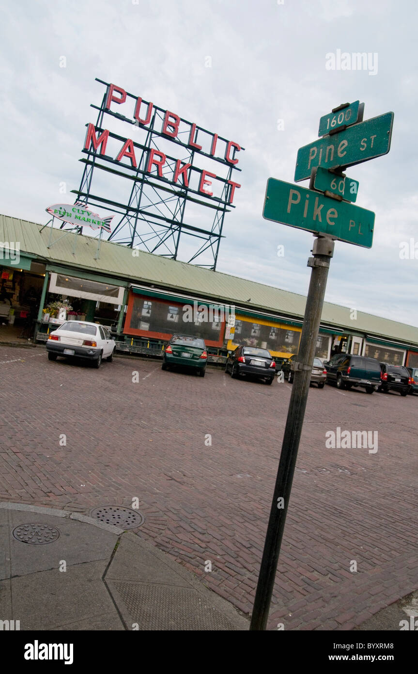street signs and cars parked at a public market; seattle, washington ...