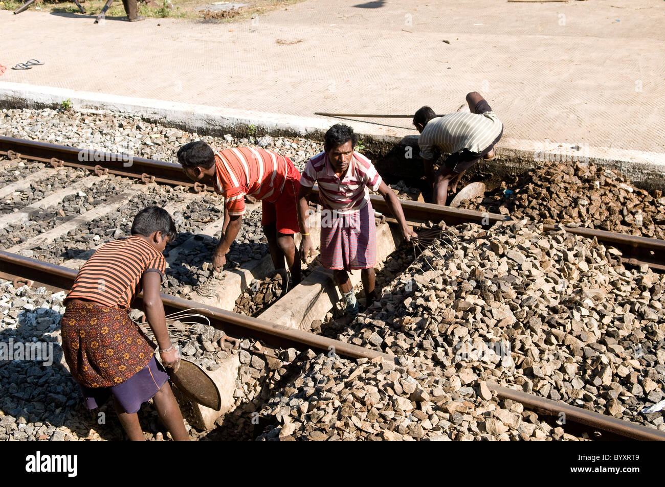 Indian construction workers fixing the rail line in Orissa Stock Photo ...