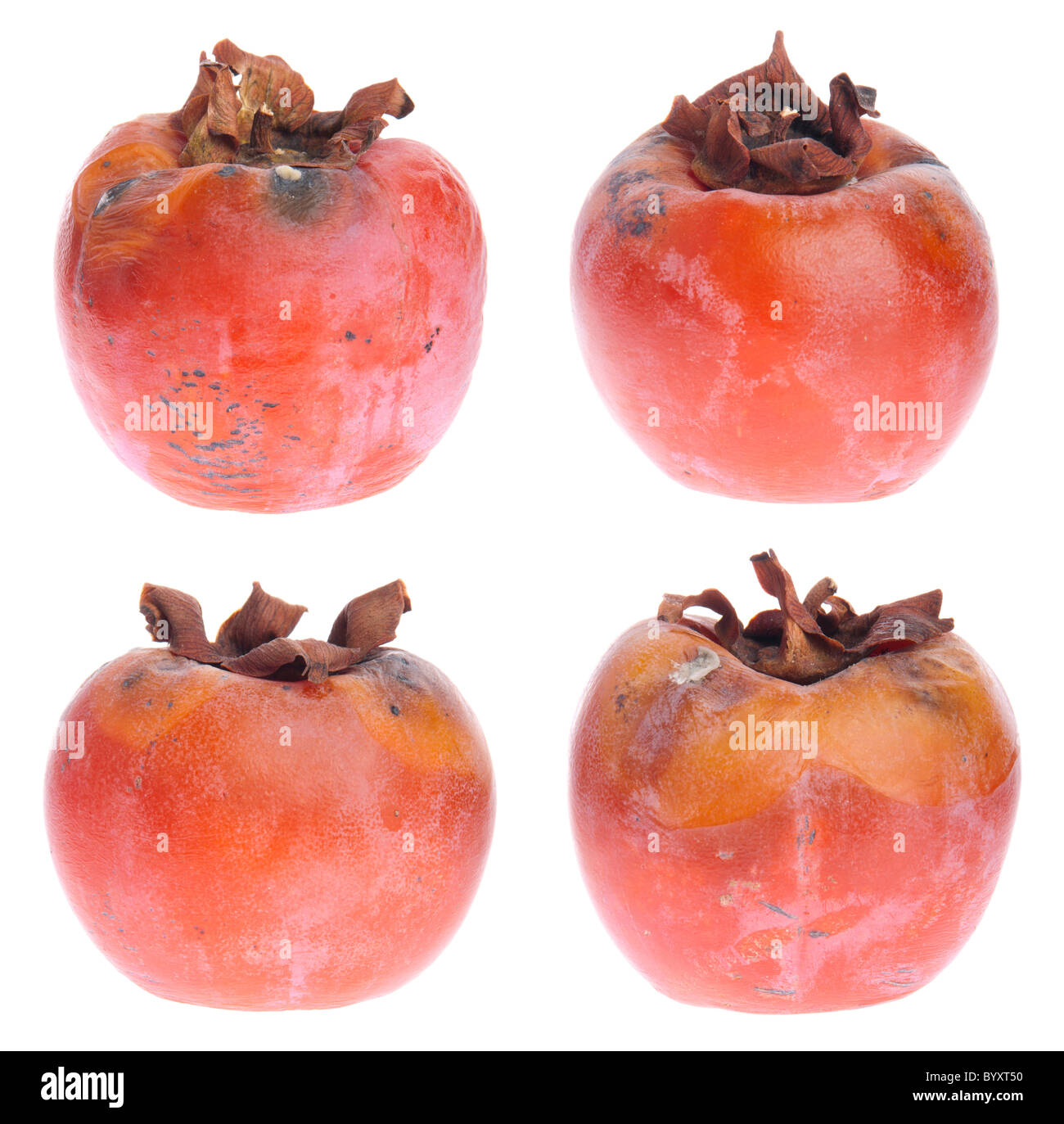four rotten persimmon fruits isolated on white background Stock Photo ...