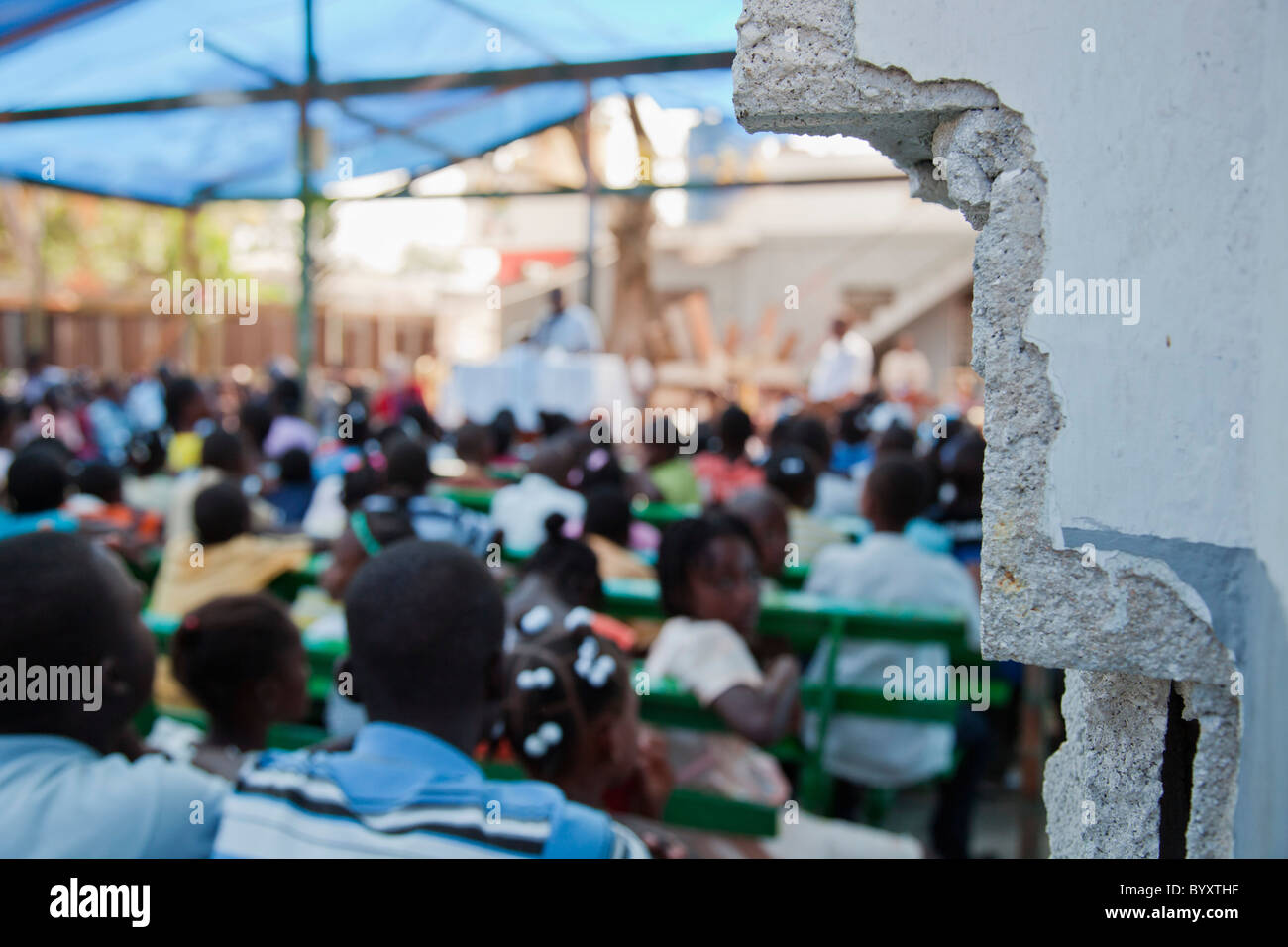 church meetings held under a tarp where a building once stood; port-au ...