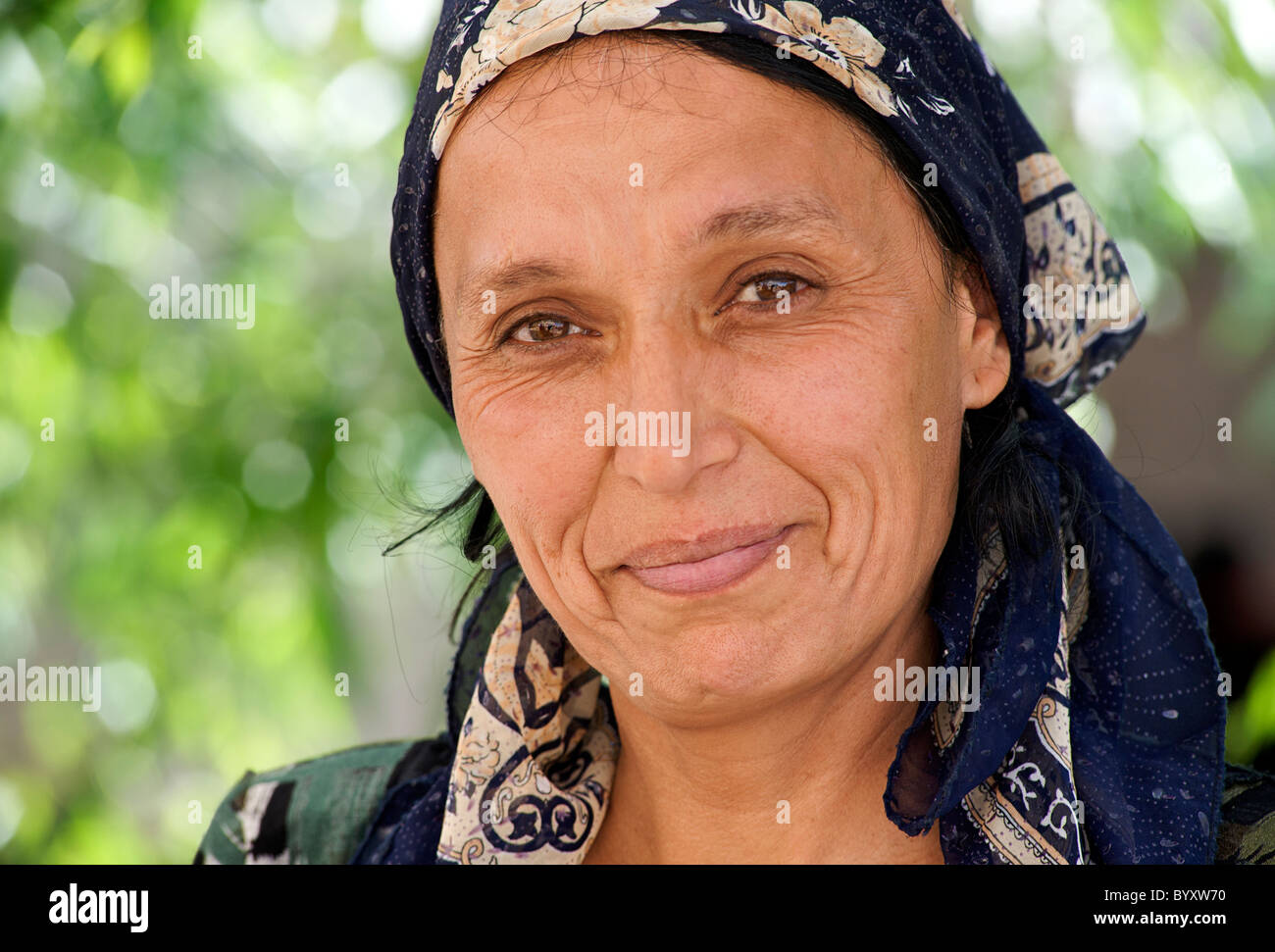 Portrait of a friendly woman selling at market, Khiva, Uzbekistan ...