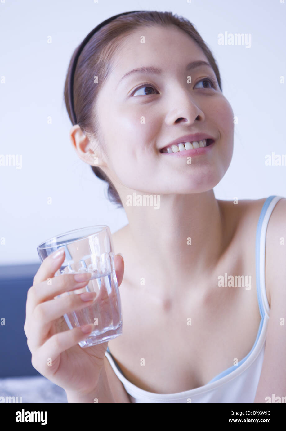 Woman drinking water Stock Photo - Alamy