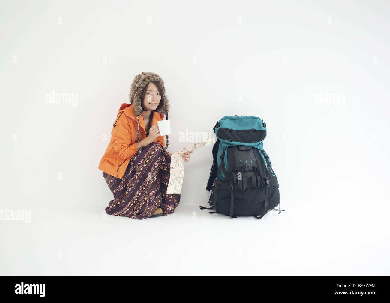 Young woman holding map Stock Photo - Alamy