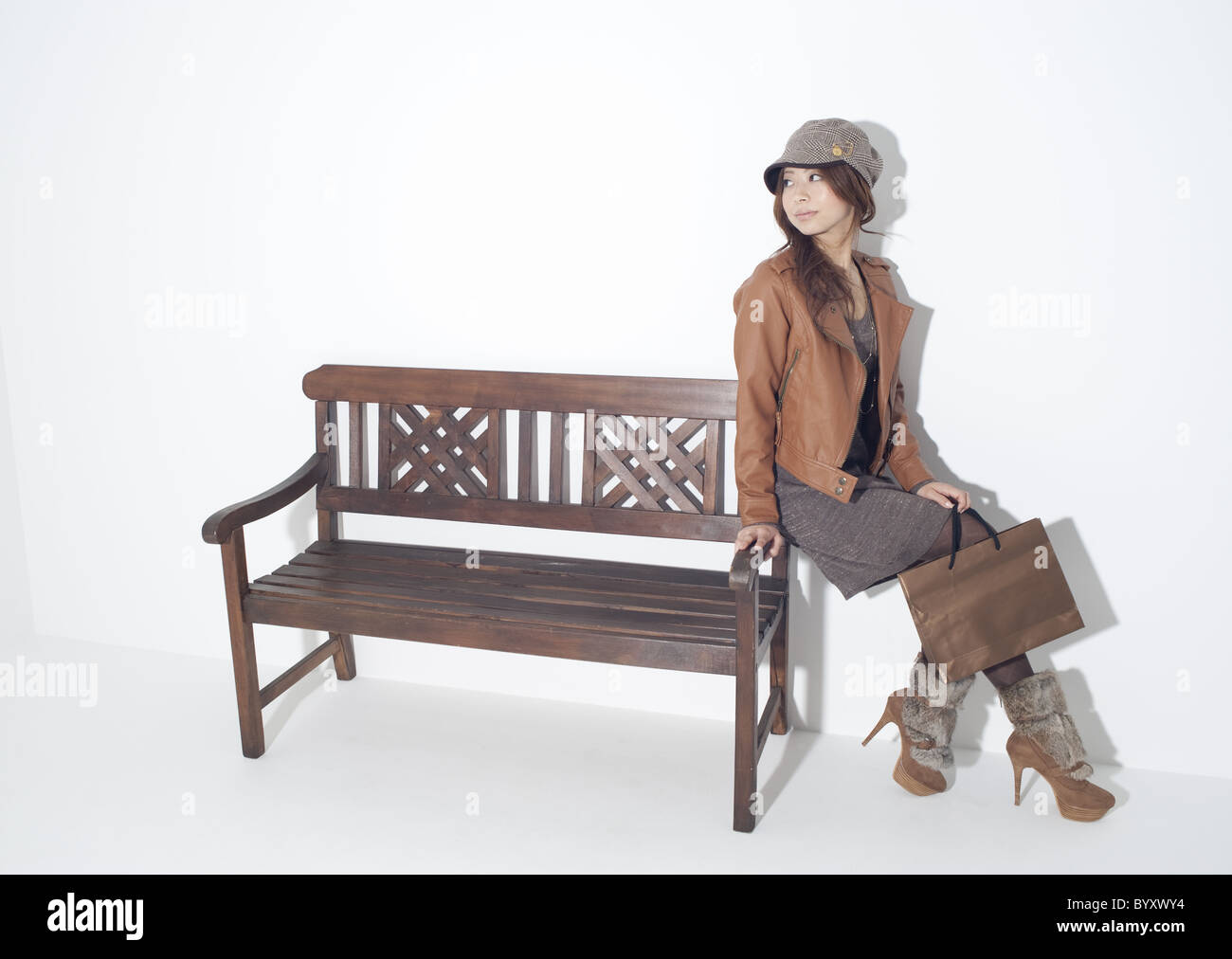 Sitting on benchs hi-res stock photography and images - Alamy