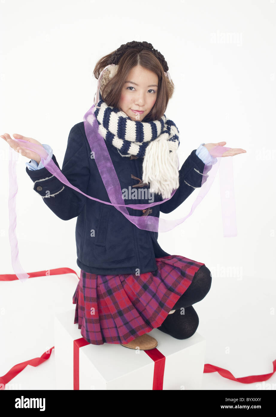 Young woman holding ribbon Stock Photo - Alamy