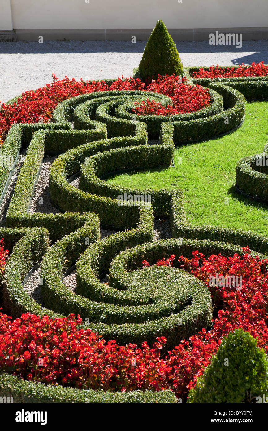 manicured hedges and shrubs with flowers in a garden; linderhof ...
