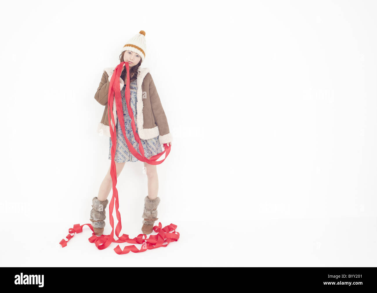 Young woman holding ribbons Stock Photo - Alamy