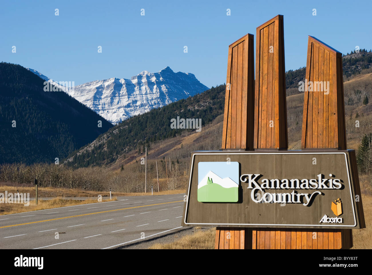 kananaskis country road sign with the mountains in the distance ...
