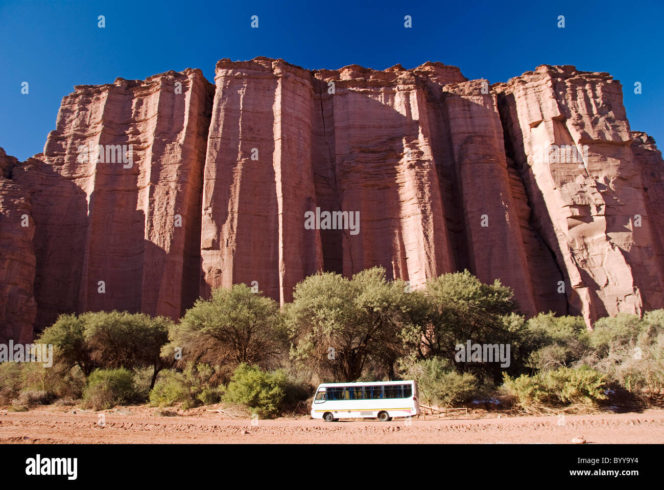 a bus in talampaya national park in front of a rock formation; la rioja ...