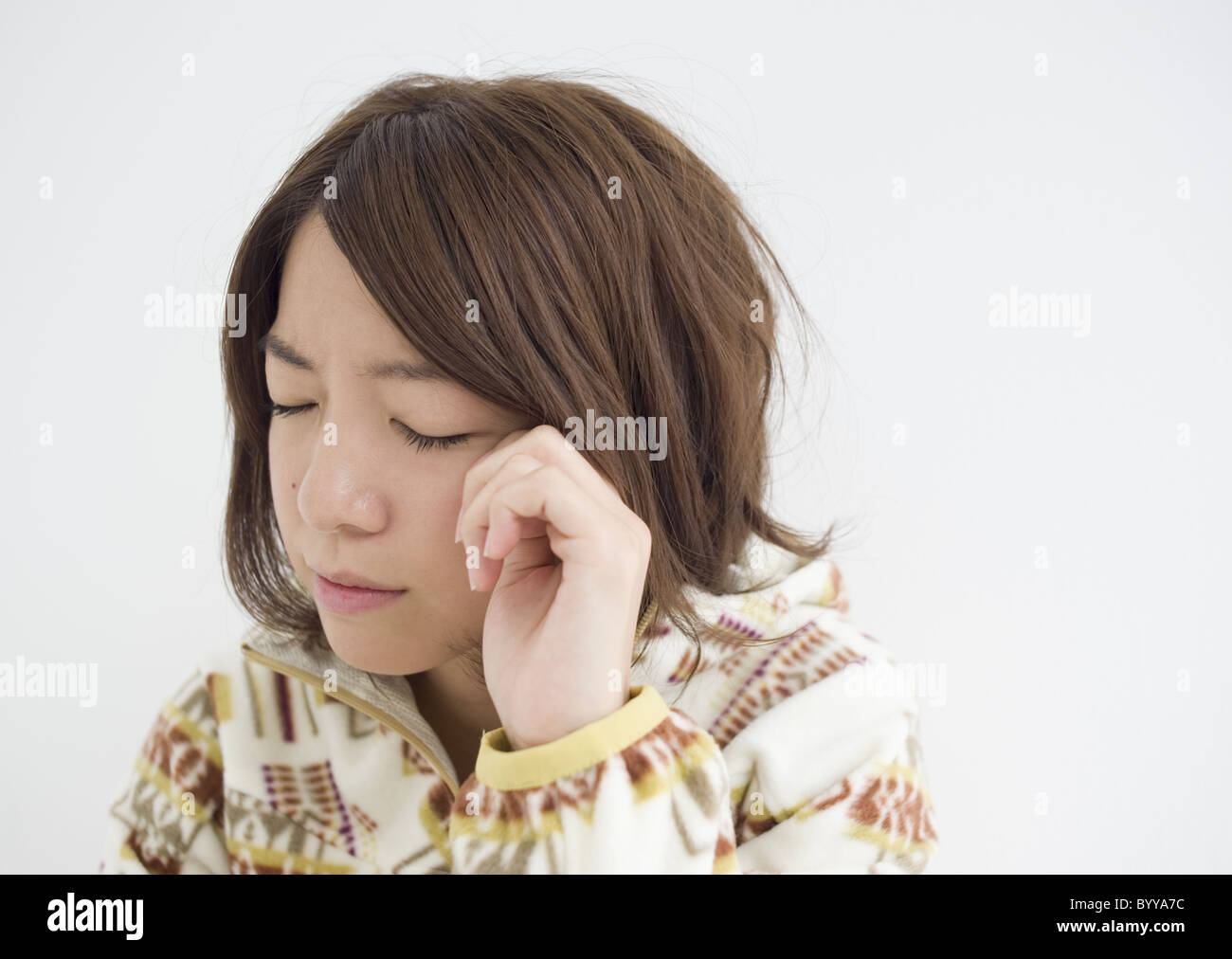 Young woman closing eyes Stock Photo - Alamy