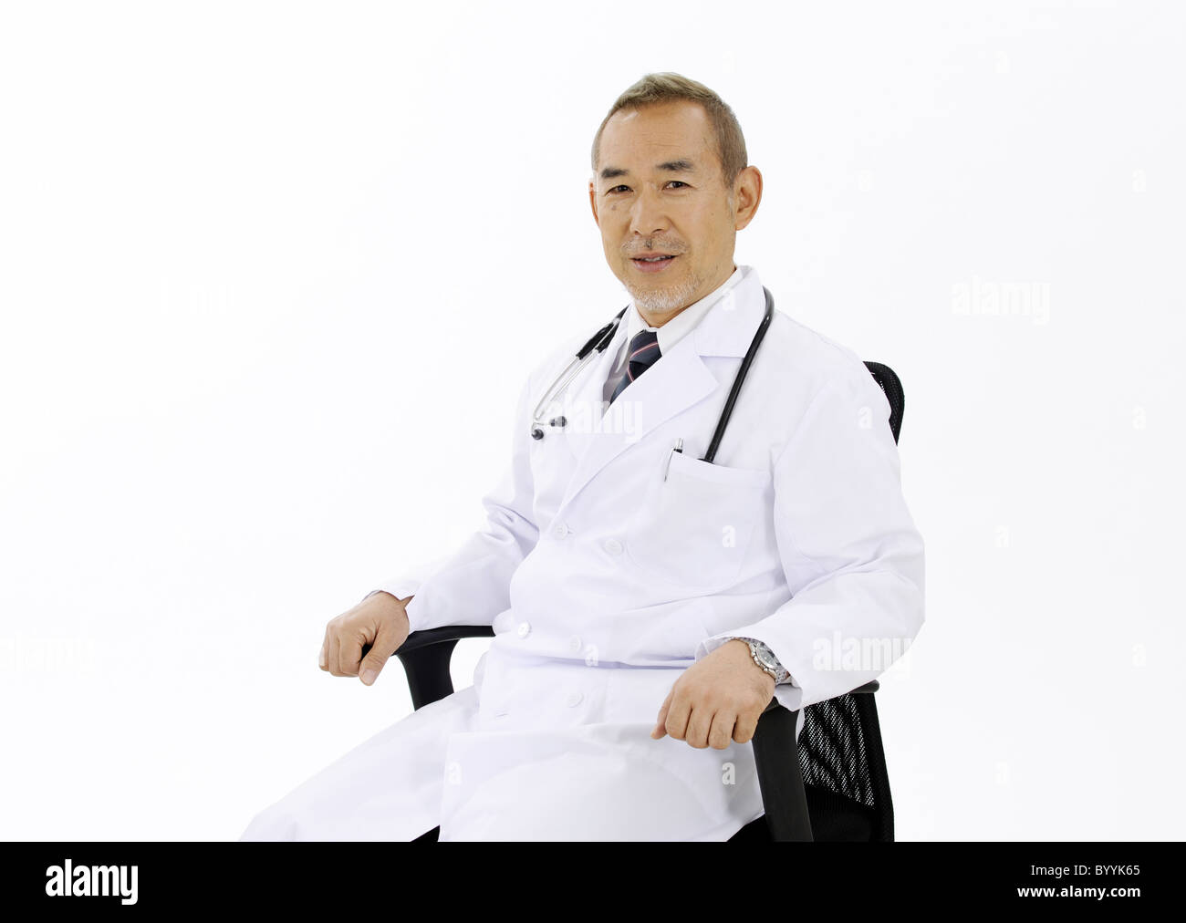 Doctor sitting on chair Stock Photo - Alamy