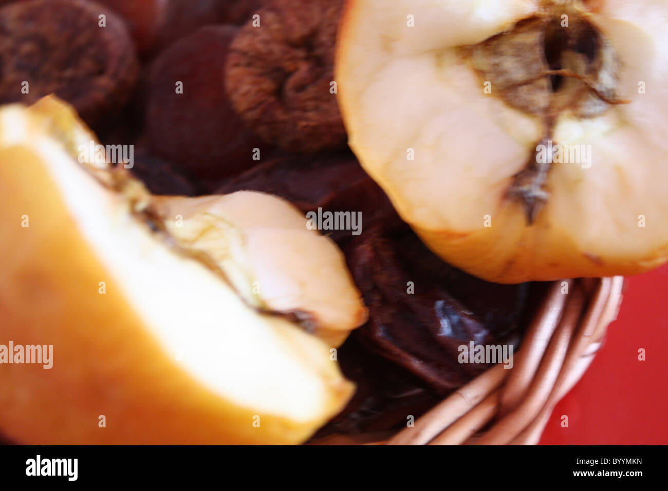 Basket with figs and rotten apple Stock Photo - Alamy