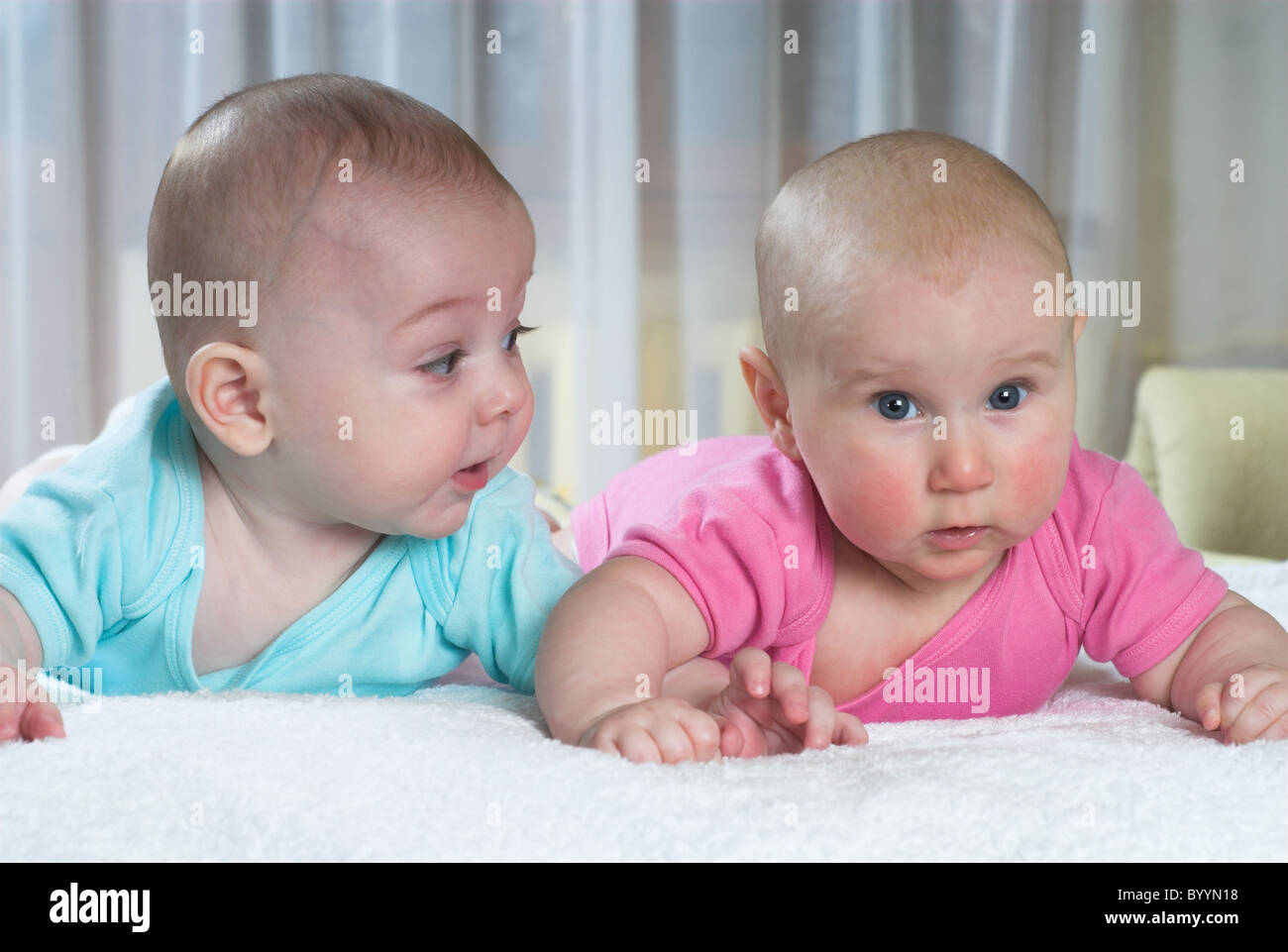 Little boy is flirting with baby girl Stock Photo - Alamy