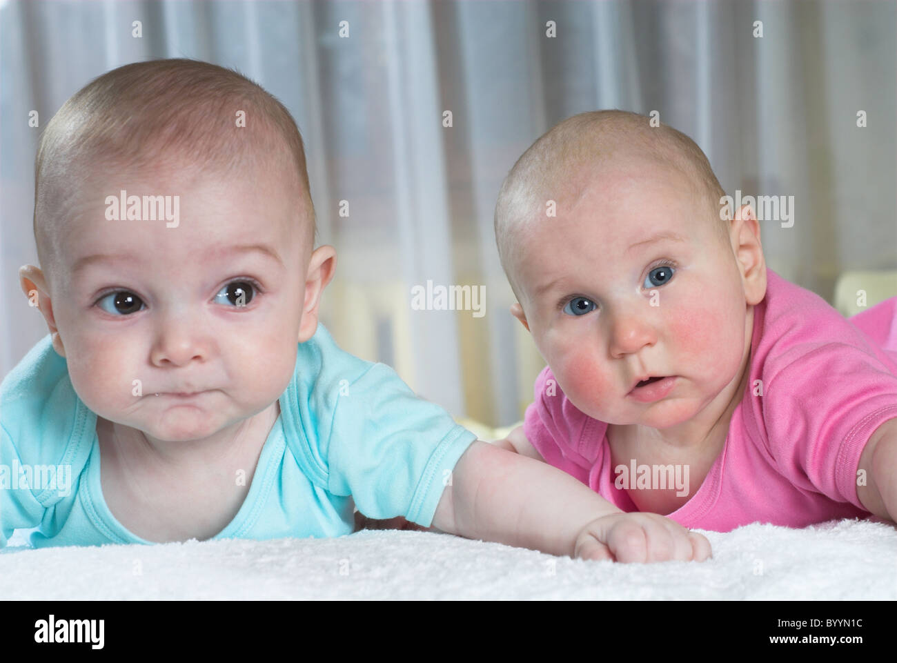 Confused boy and girl in pink and blue Stock Photo - Alamy