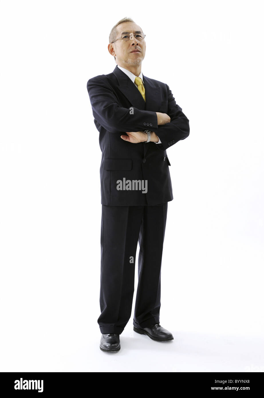 Businessman folding arms Cut Out Stock Images & Pictures - Alamy