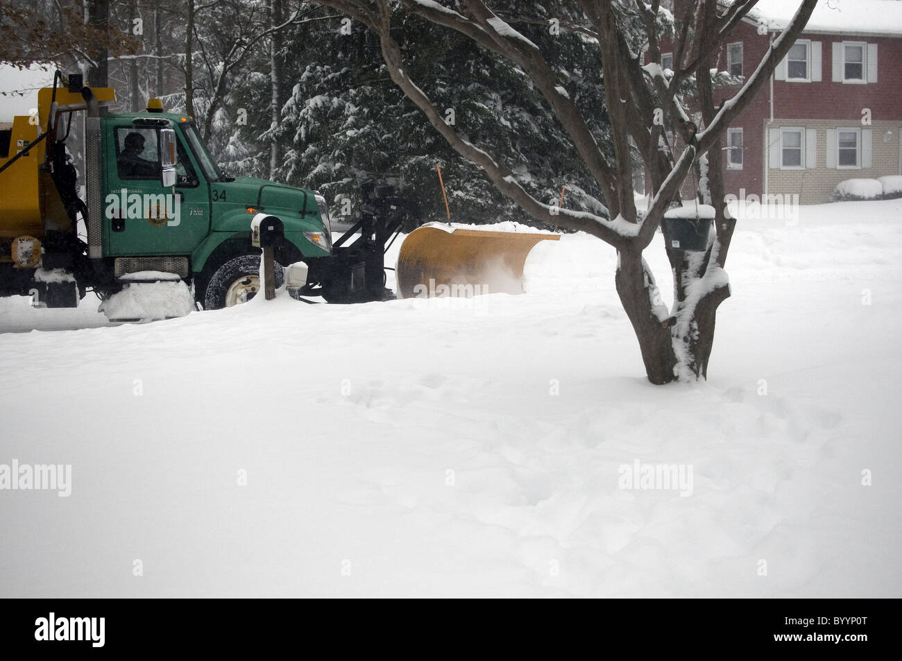 Truck plowing snow Stock Photo - Alamy