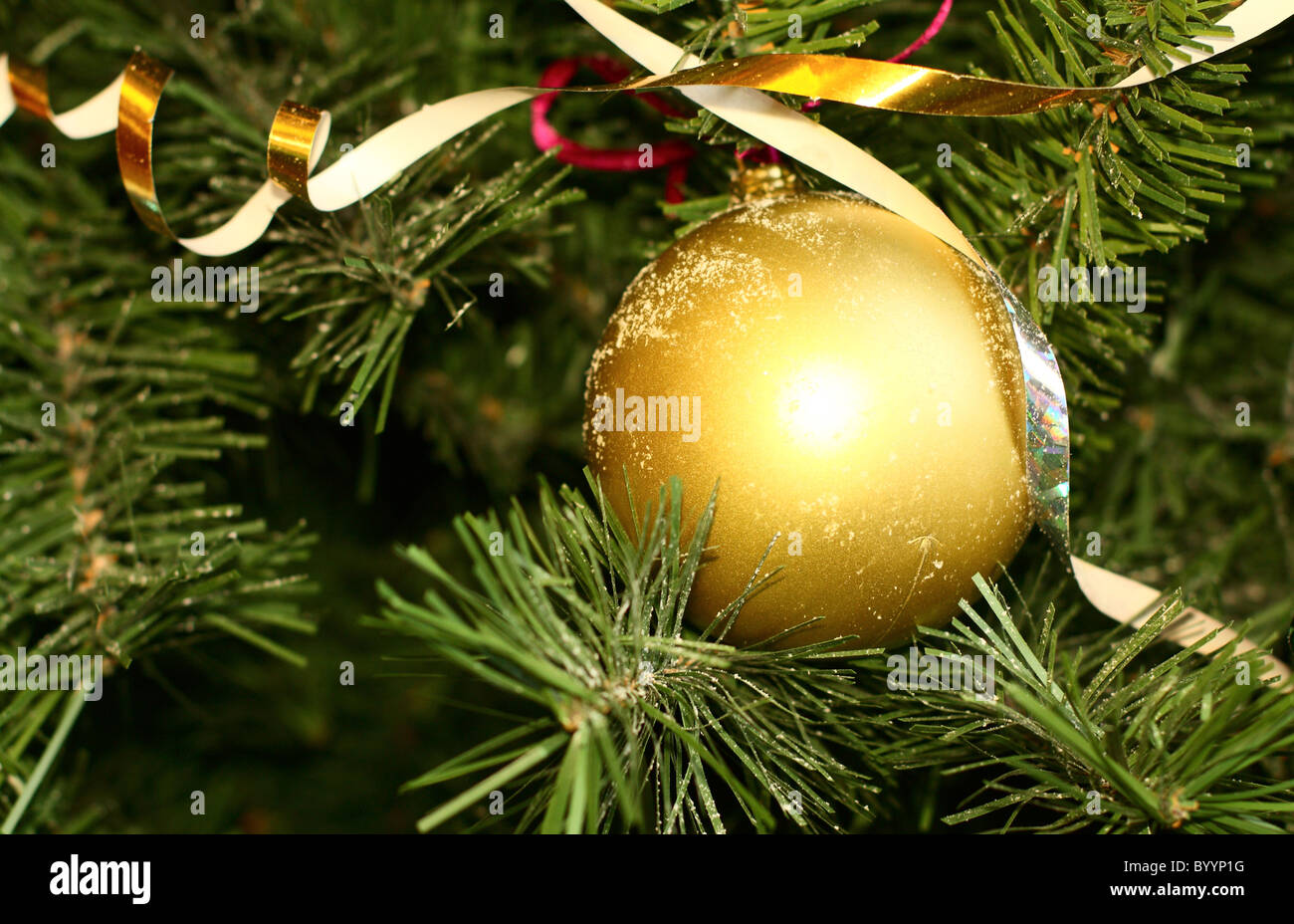 Bright festive balls on a Christmas tree Stock Photo - Alamy
