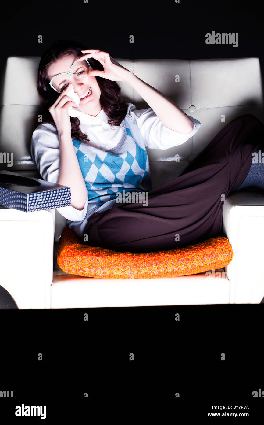 Geeky girl crying whilst watching television Stock Photo - Alamy