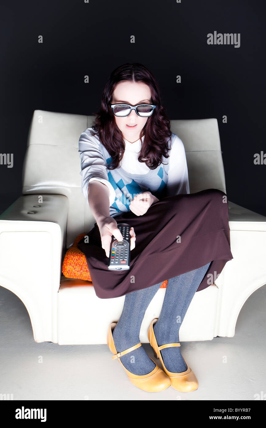 Geek woman watching 3D television Stock Photo - Alamy