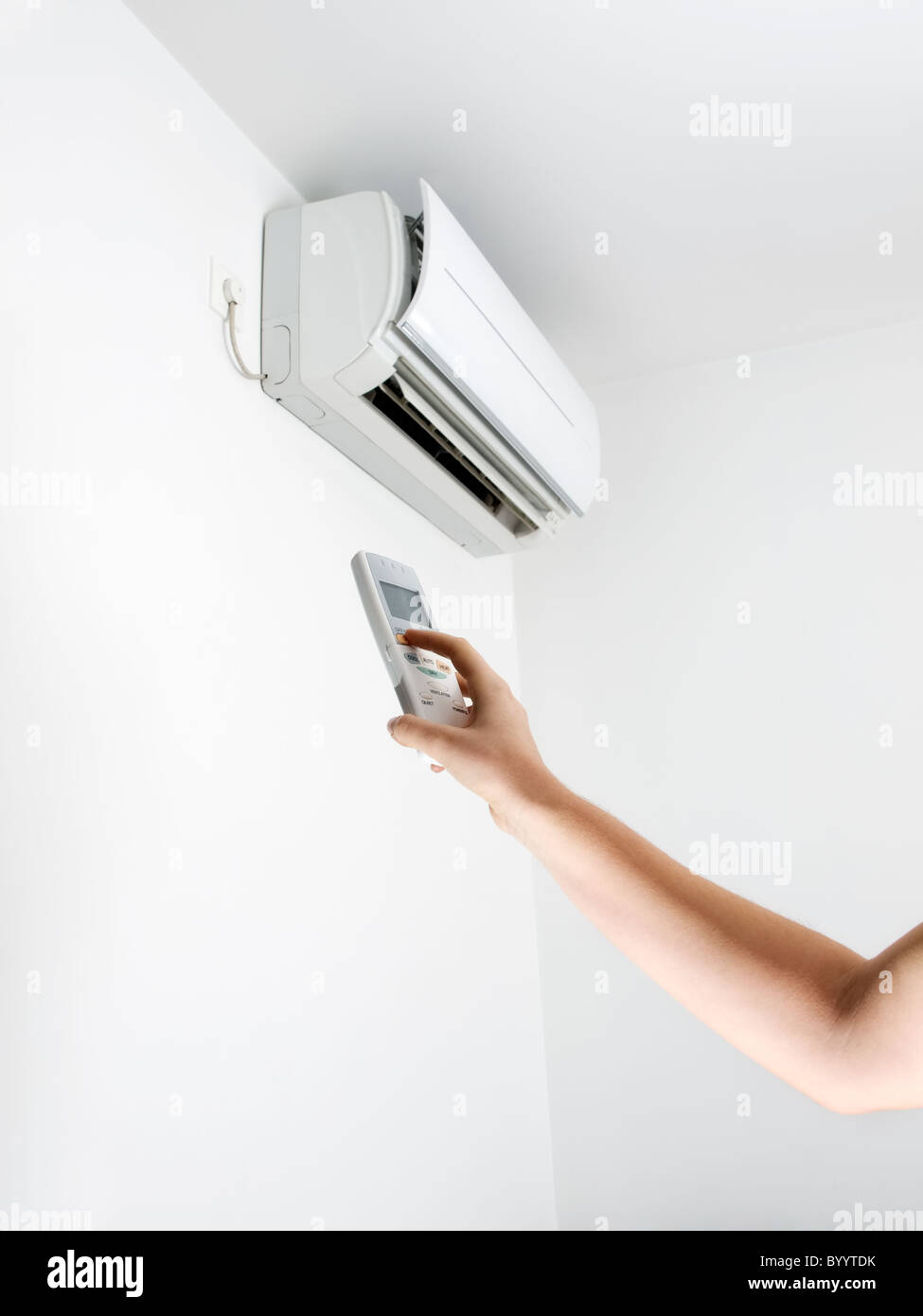 Arm, remote control and air conditioning Stock Photo - Alamy
