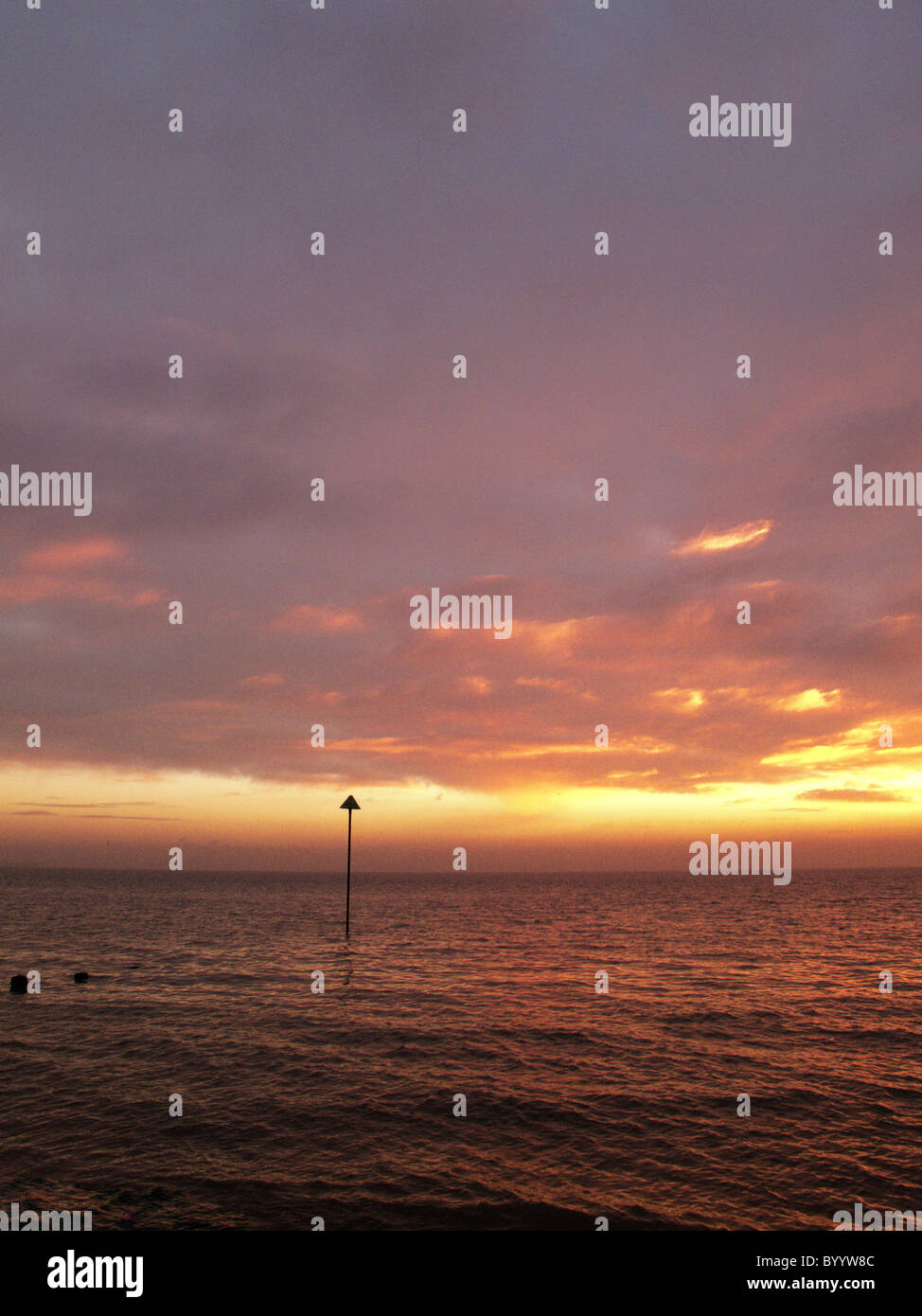 landscape image of south end on sea in essex england at sunset during ...