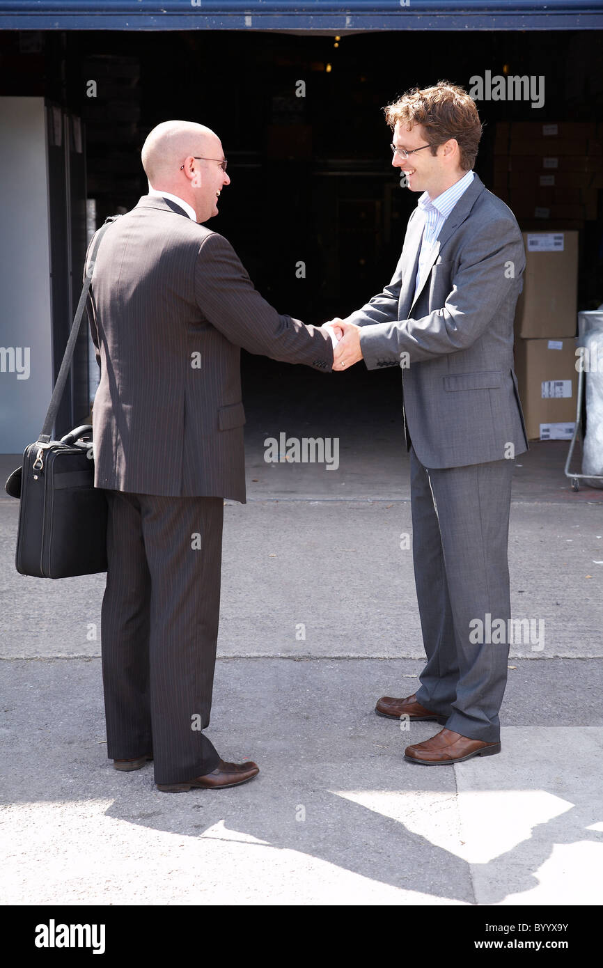 Businessmen shaking hands Stock Photo - Alamy