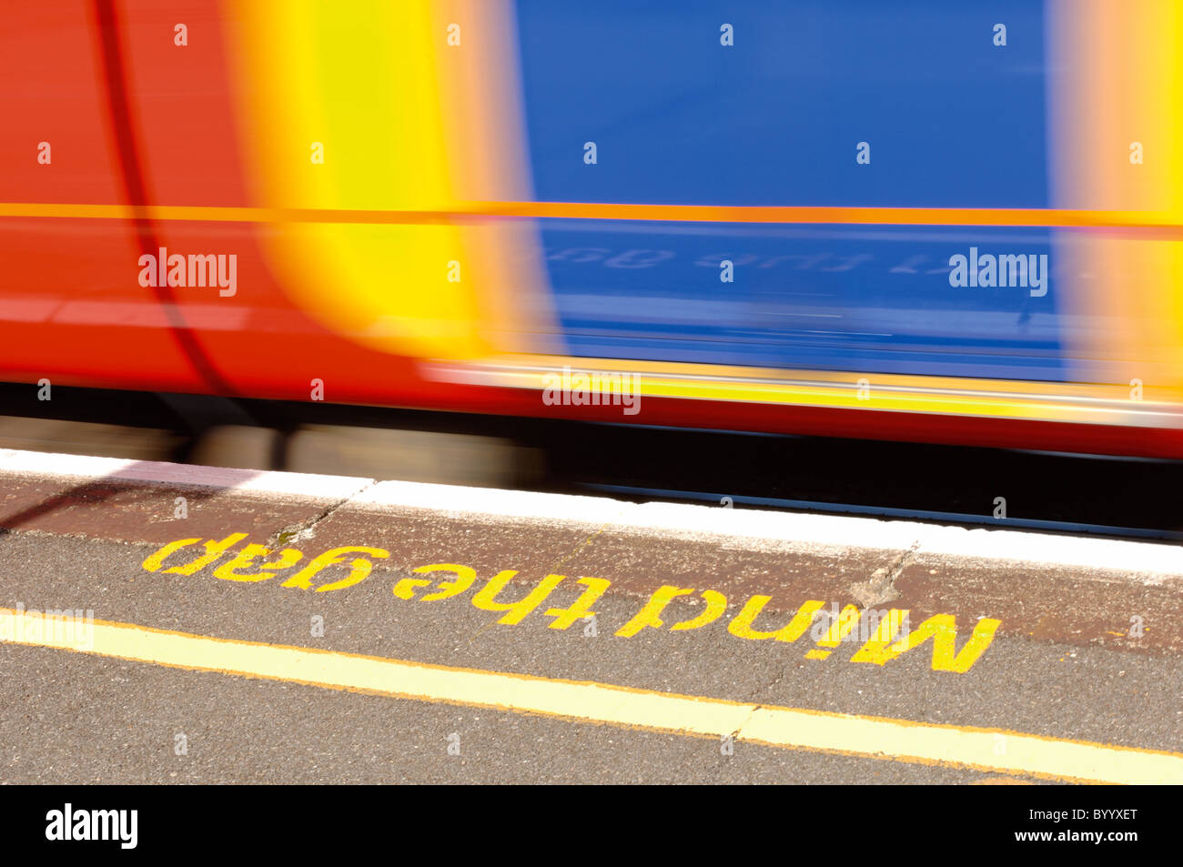 Mind the Gap train blurred Stock Photo - Alamy