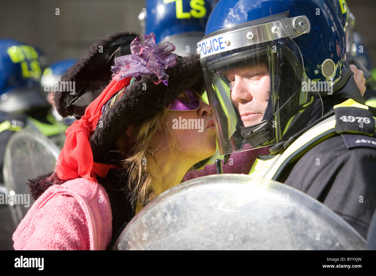 A G20 protester kisses a riot policeman at Bank 5pm 2/4/09 Stock Photo ...
