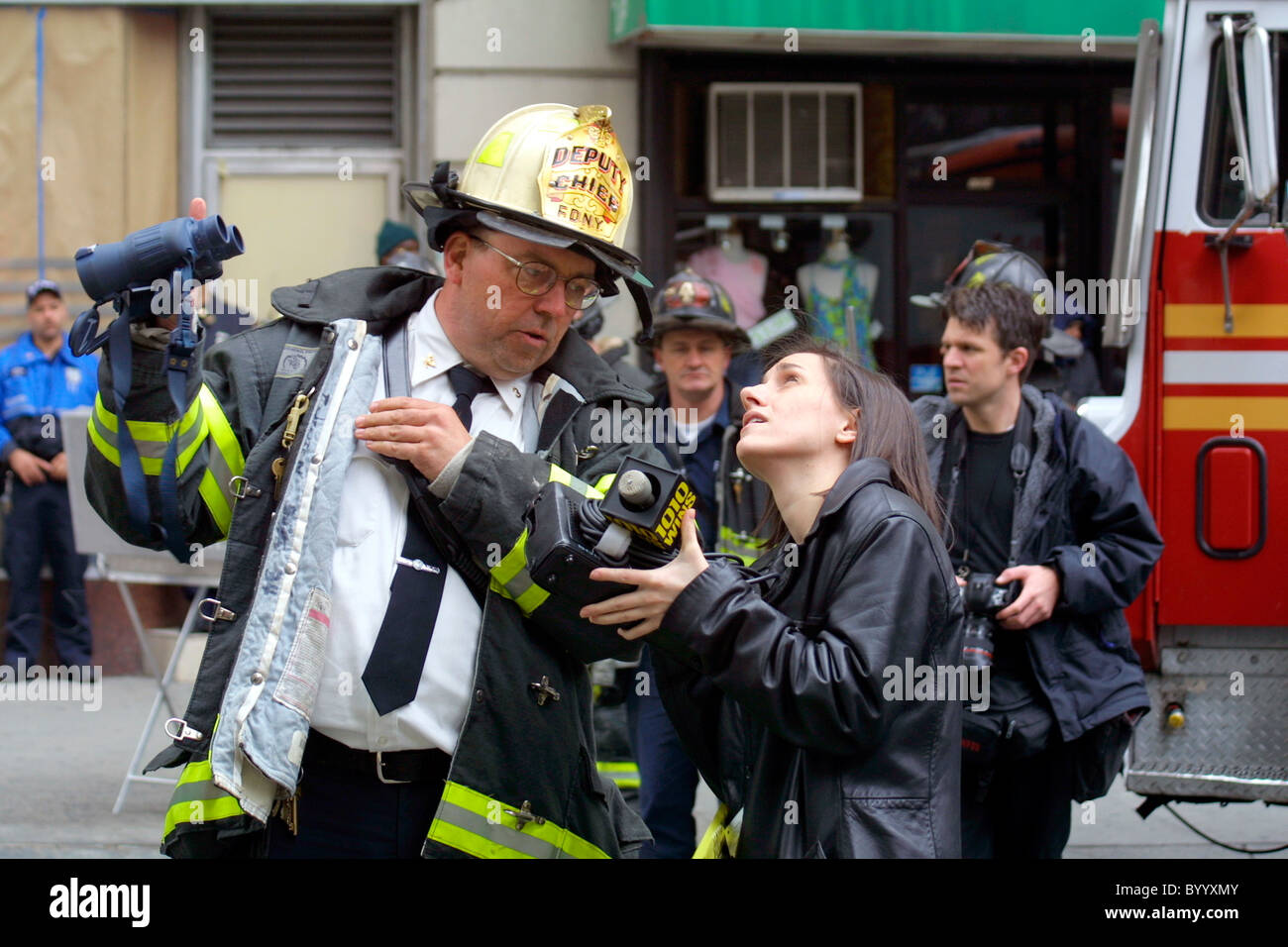 FDNY Deputy Chief gives an on scene press interview Stock Photo - Alamy