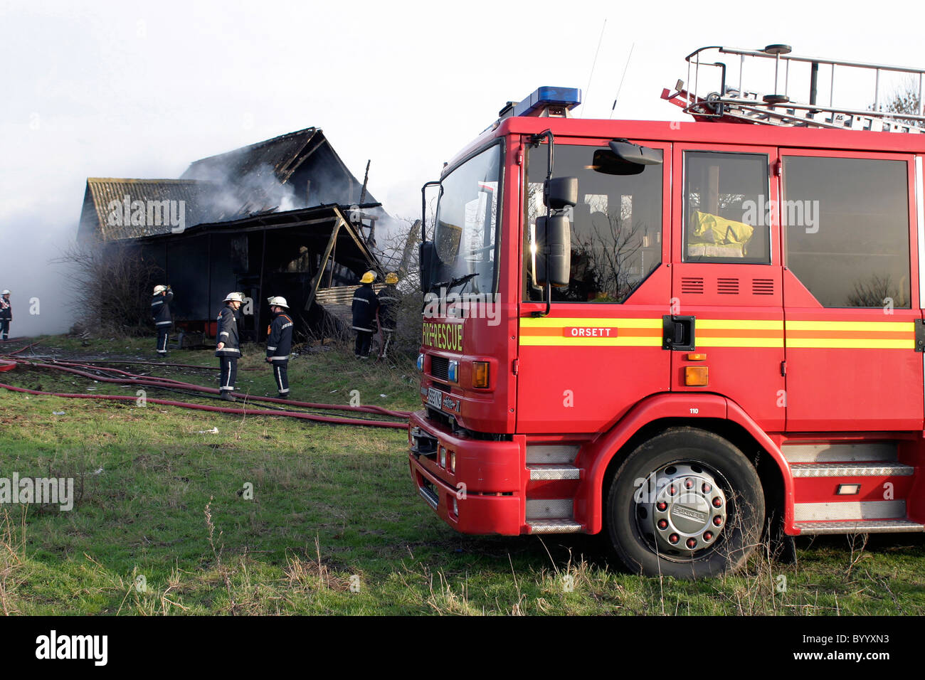 Essex fire engine at scene of a barn fire Stock Photo - Alamy