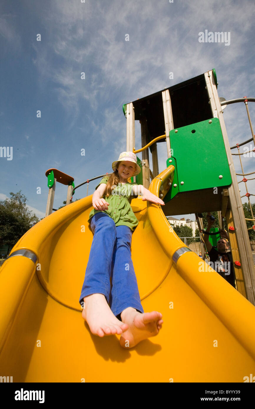 Girl on a slide Stock Photo - Alamy