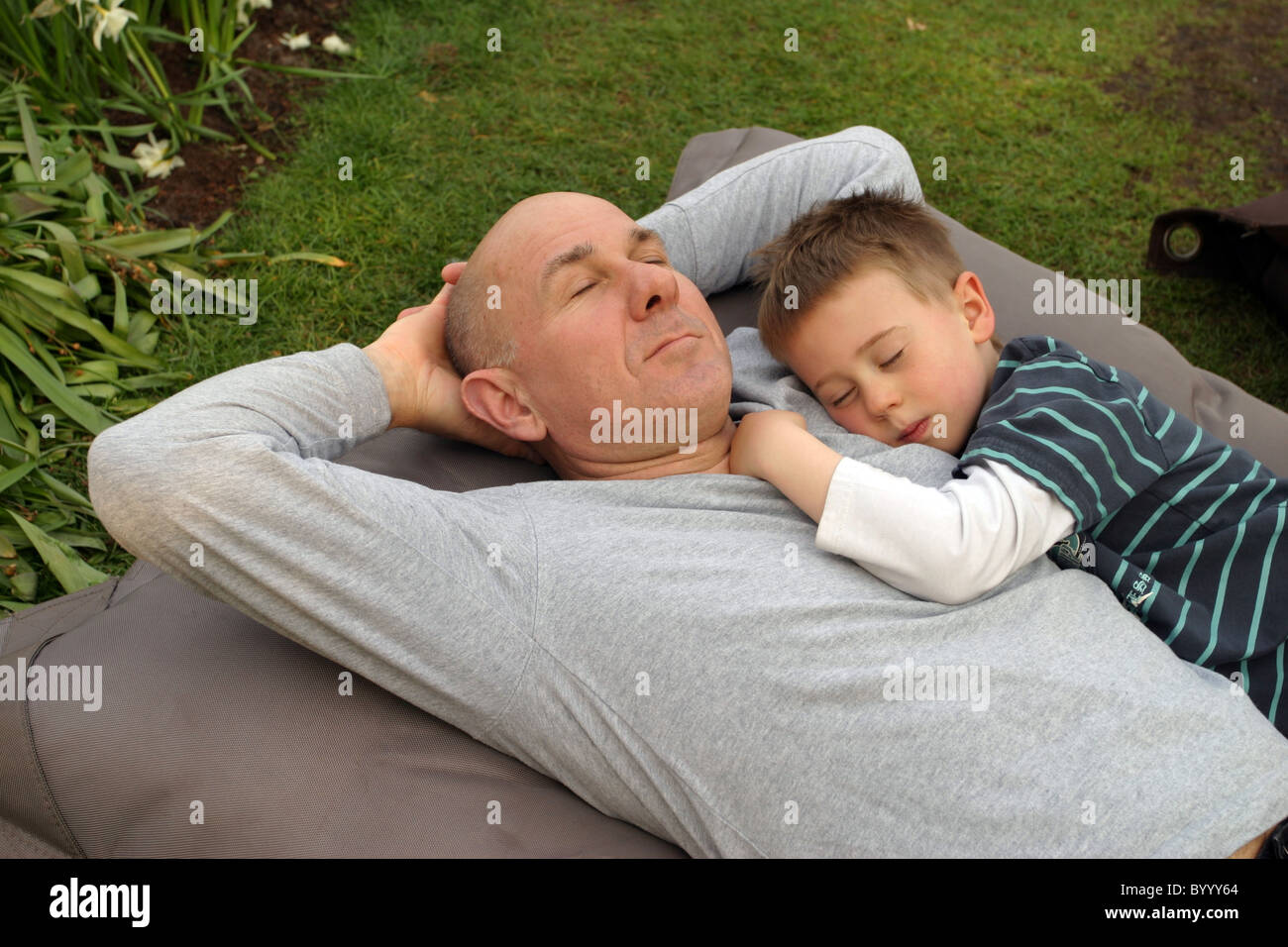 Boy Asleep On Grass High Resolution Stock Photography and Images - Alamy
