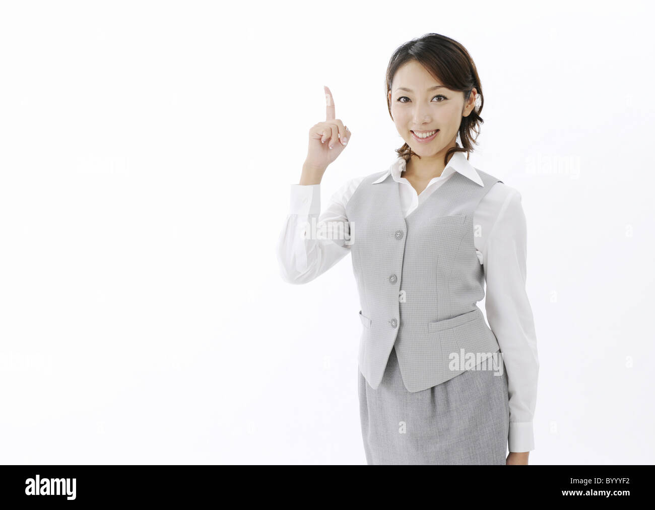 Office worker pointing with her finger Stock Photo - Alamy