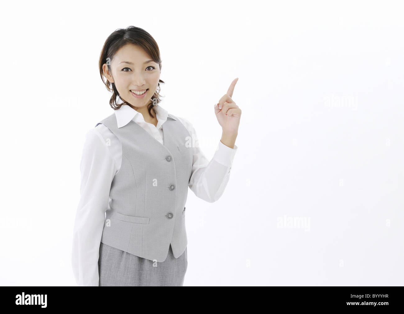Office worker pointing with her finger Stock Photo - Alamy